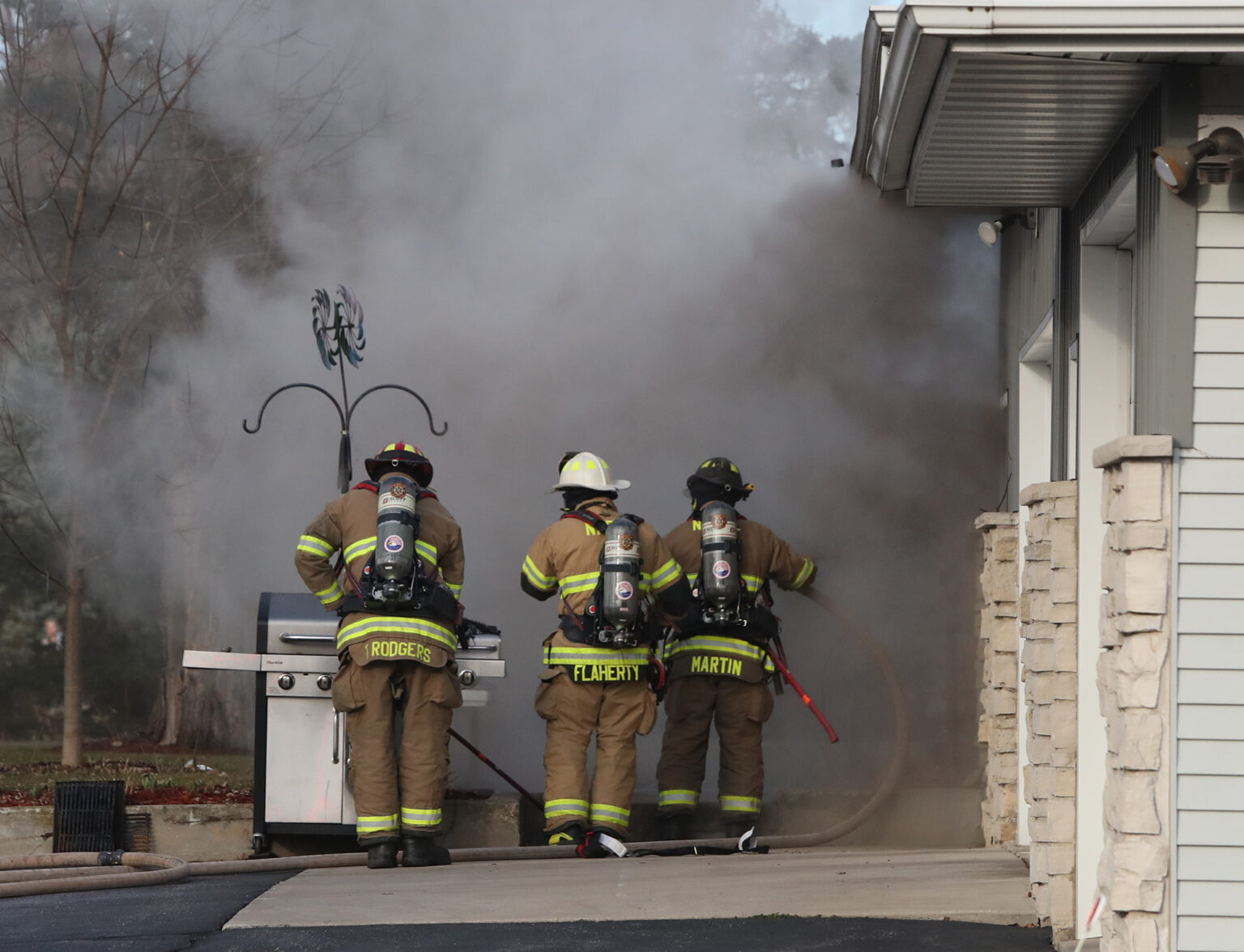 Local firefighters save house from attached garage fire on Highway 23 ...