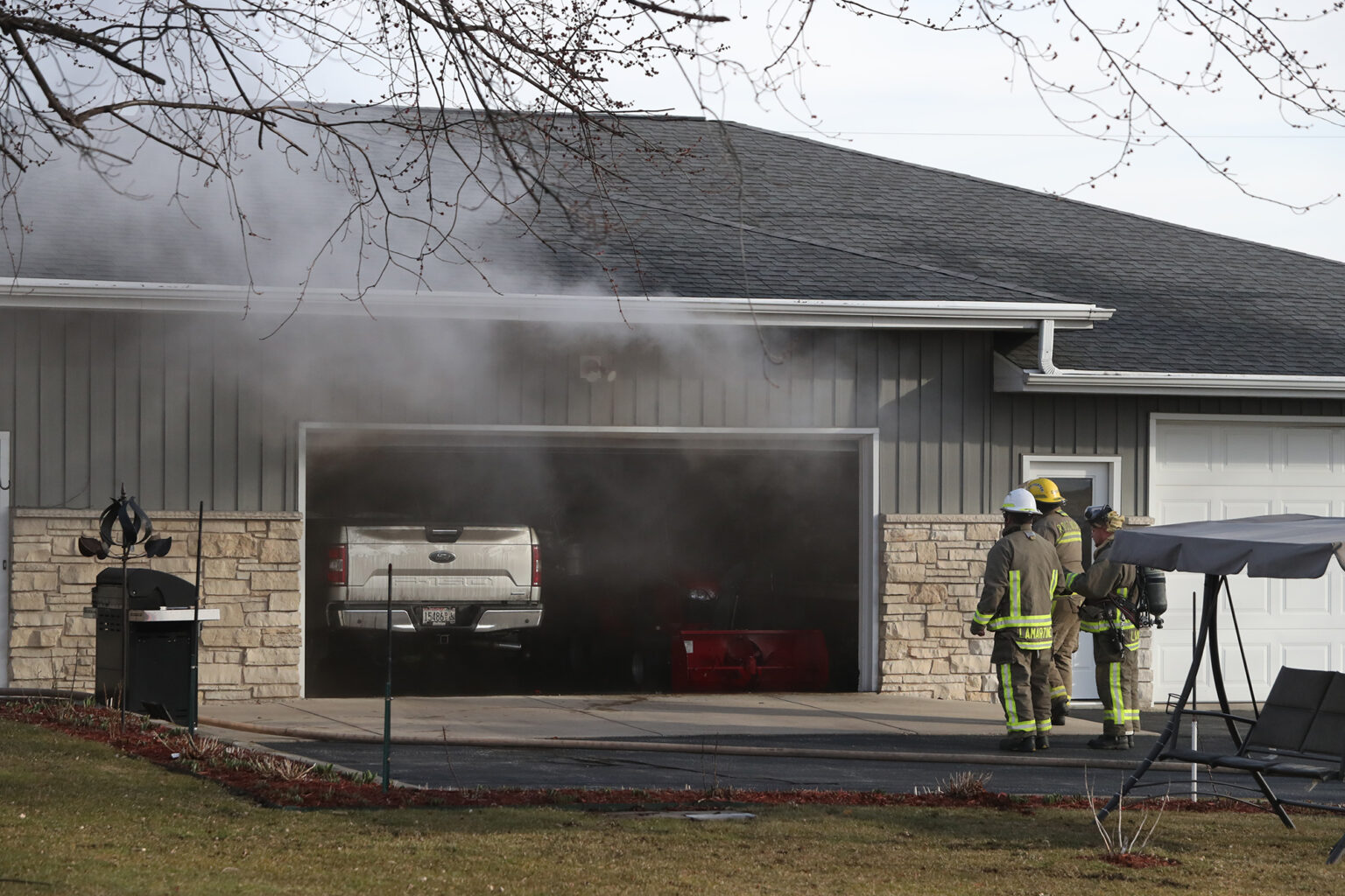 Local firefighters save house from attached garage fire on Highway 23 ...